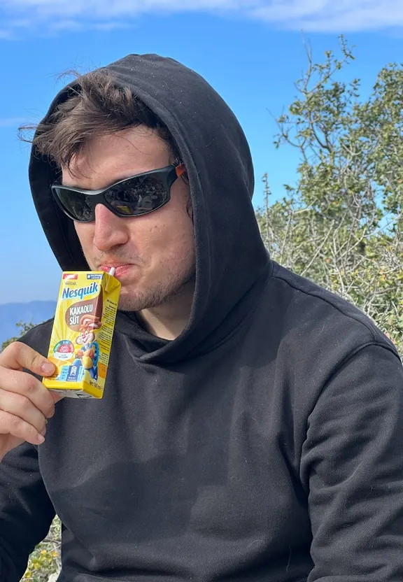 a man in a hoodie eating a box... | Video by EfficaciousPenguin3