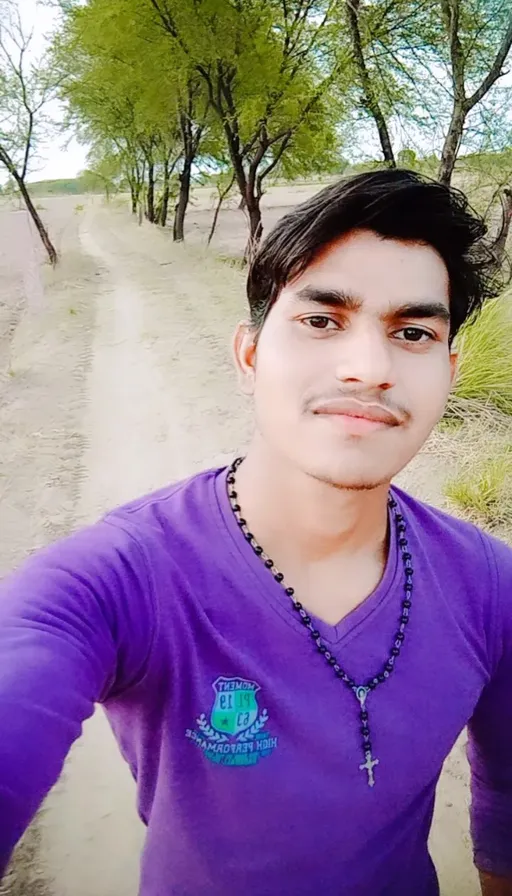 a man in a purple shirt is... | Image by SharkFriendly